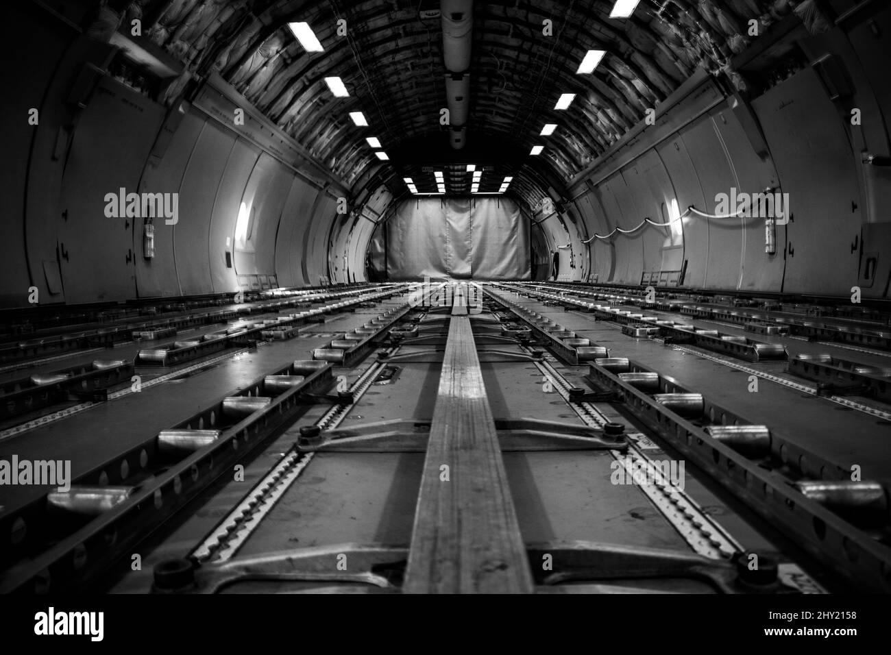Grayscale shot of the cargo hold of an airplane Stock Photo - Alamy