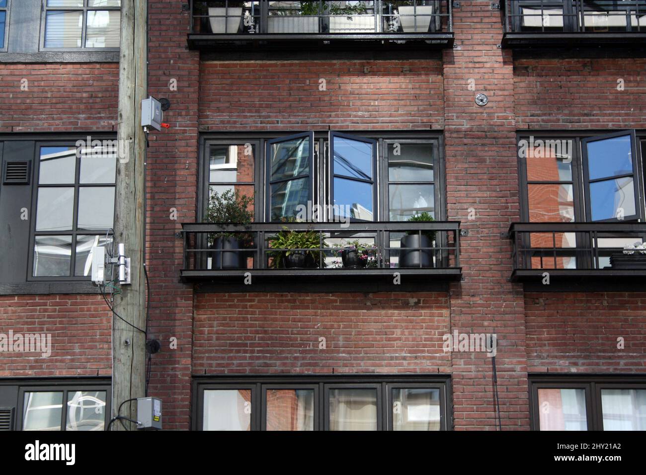 Shot of the balconies in a residential building made with bricks Stock ...