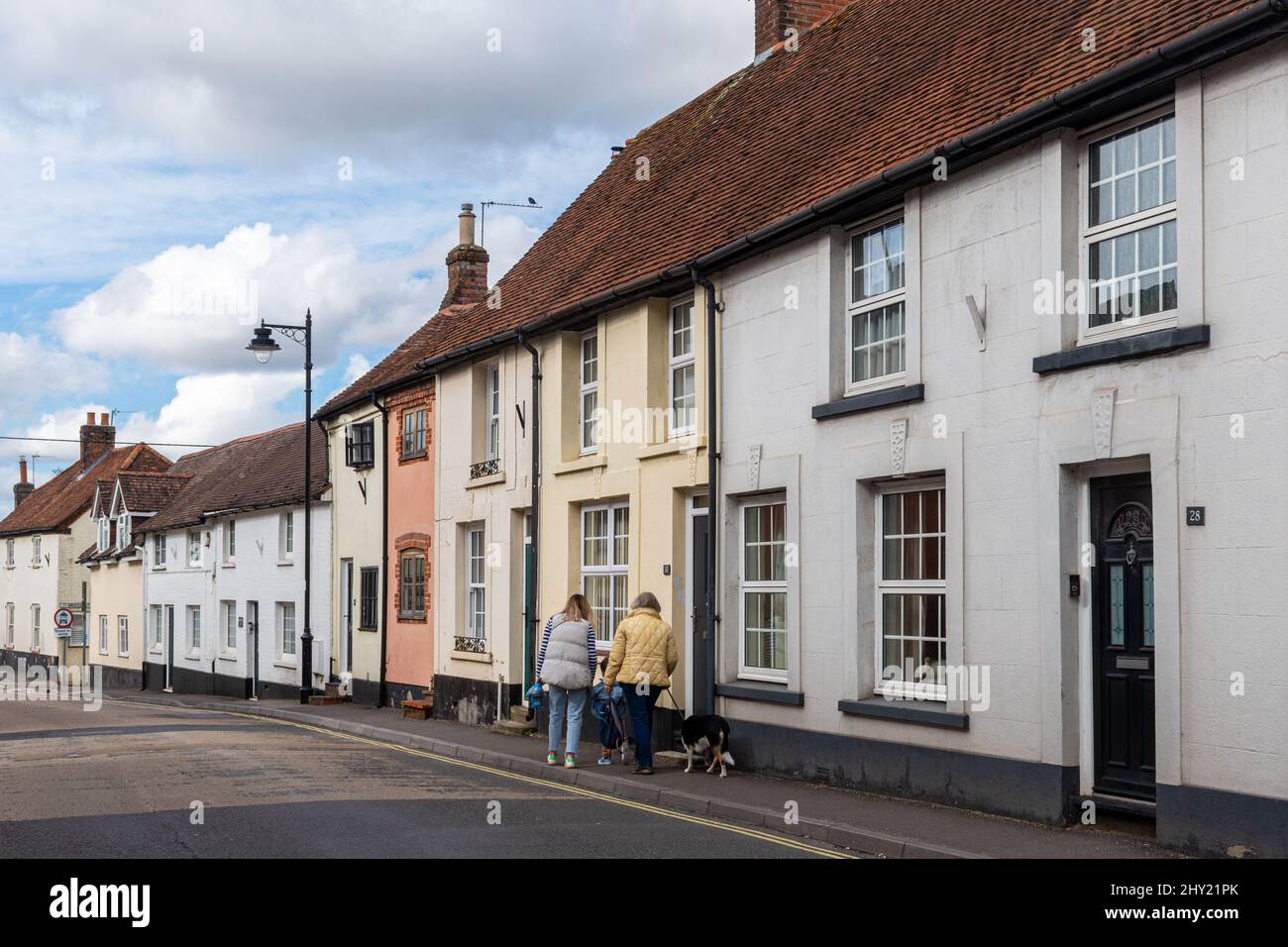 Overton village, Hampshire, England, UK, with people walking along the ...