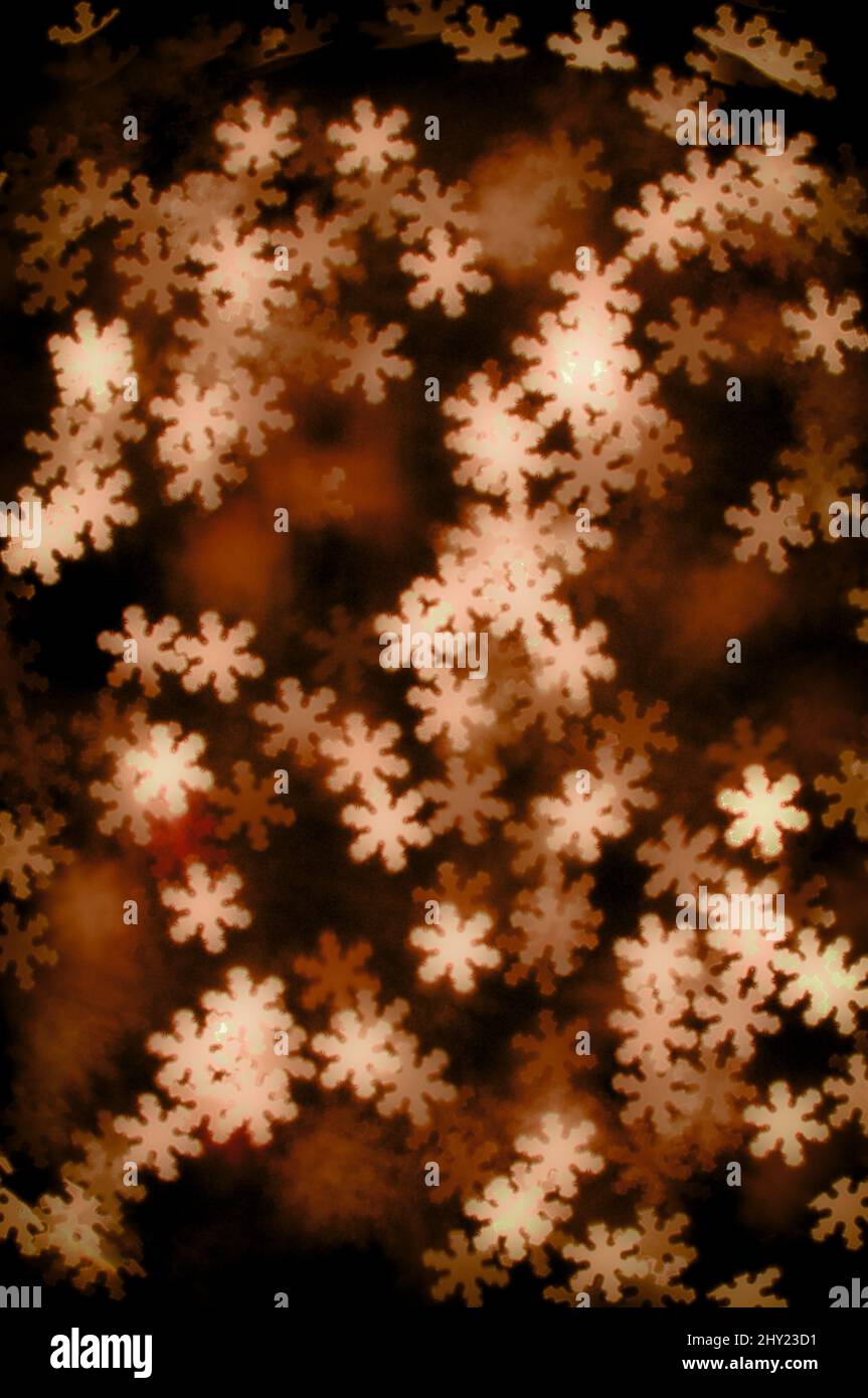 Vertical shot of a snowflake light bokeh background for wallpapers ...