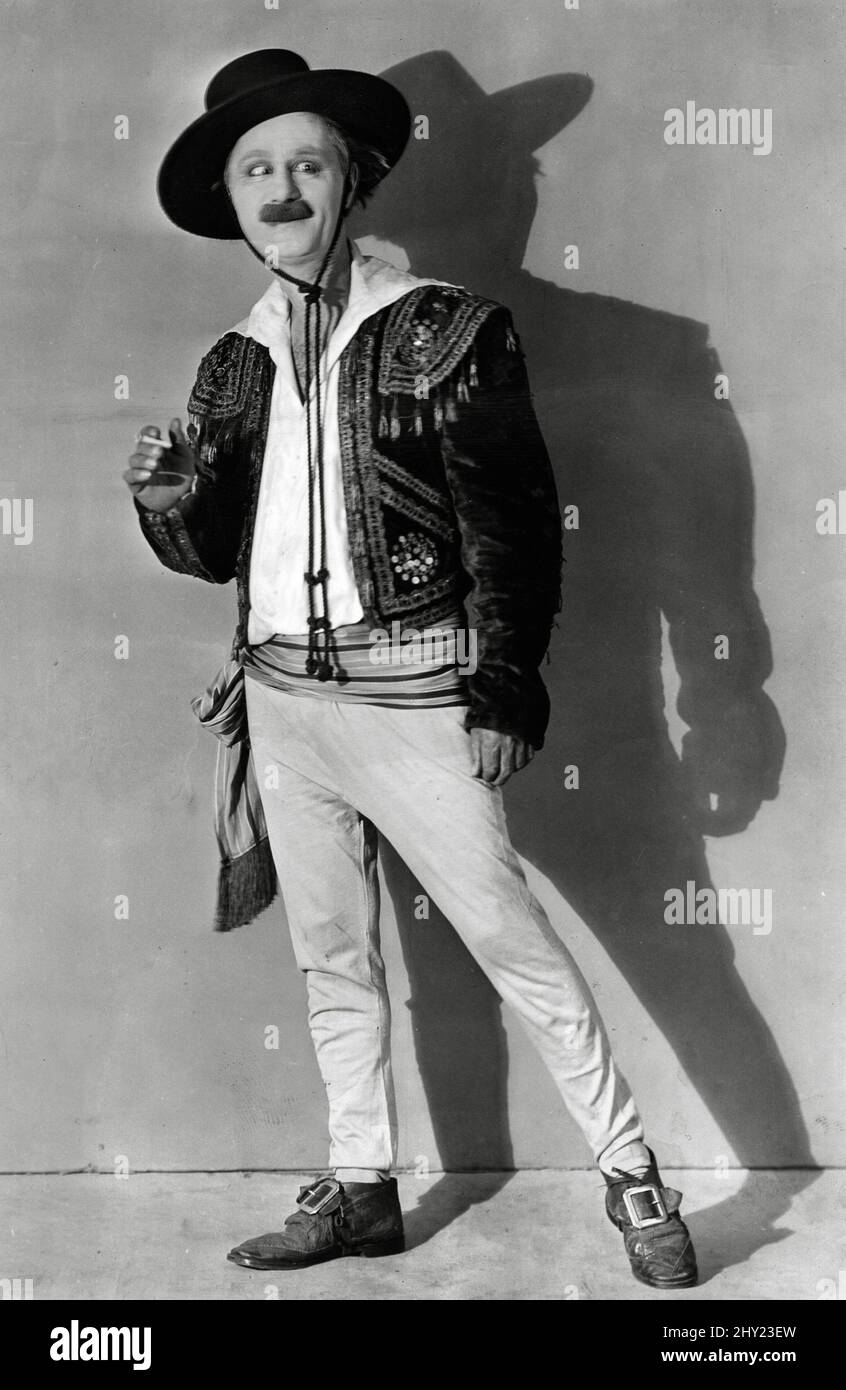 Silent film star Ben Turpin, in a western costume as a gaucho / cowboy ...