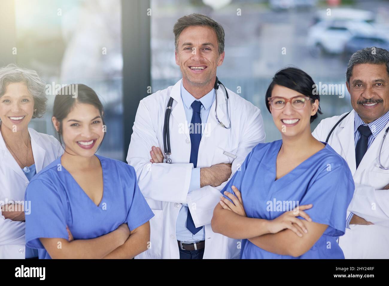 Here to keep you healthy and happy. Portrait of a team of medical practitioners standing ...