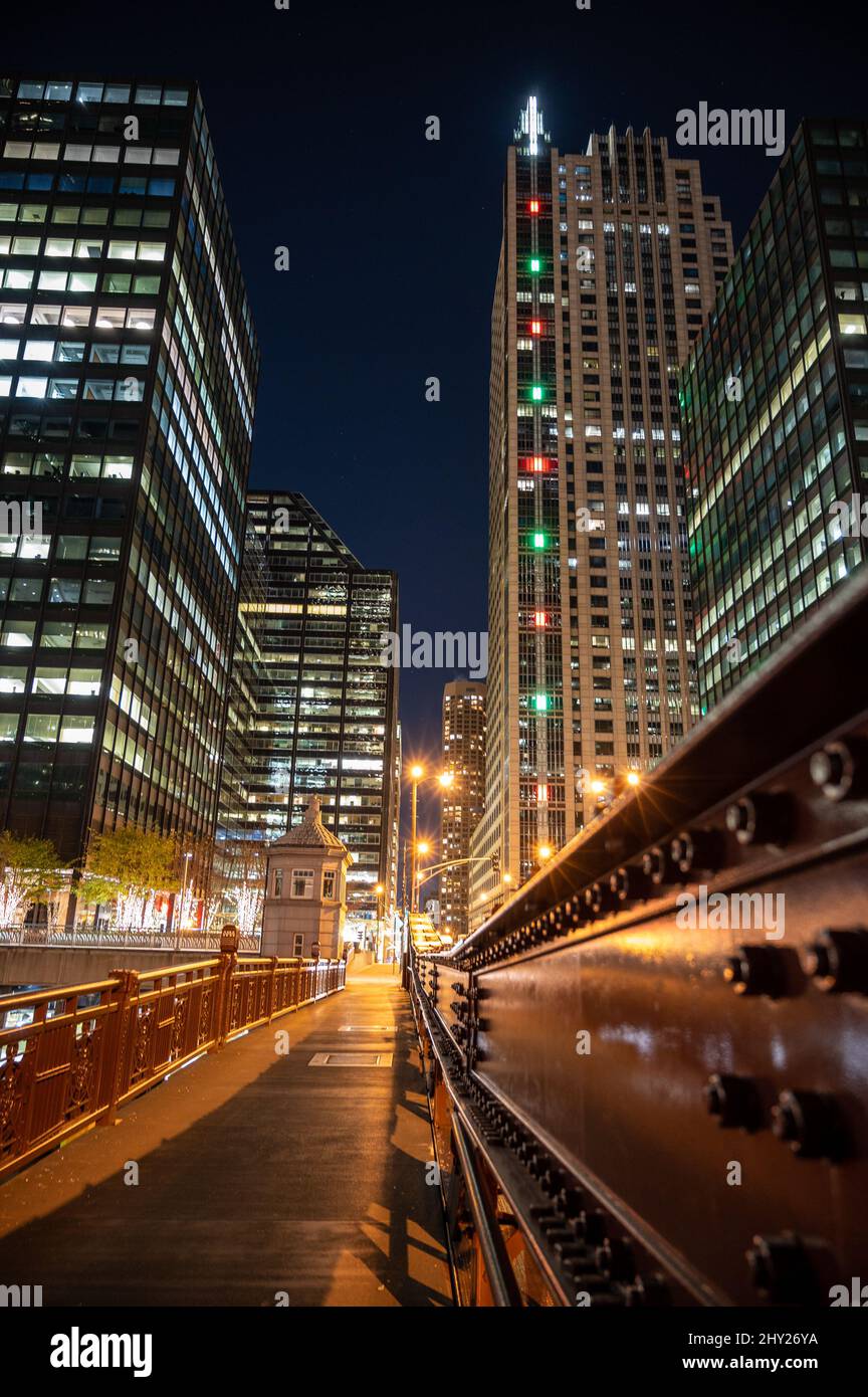 Beautiful night view of Chicago street with tall buildings Stock Photo ...