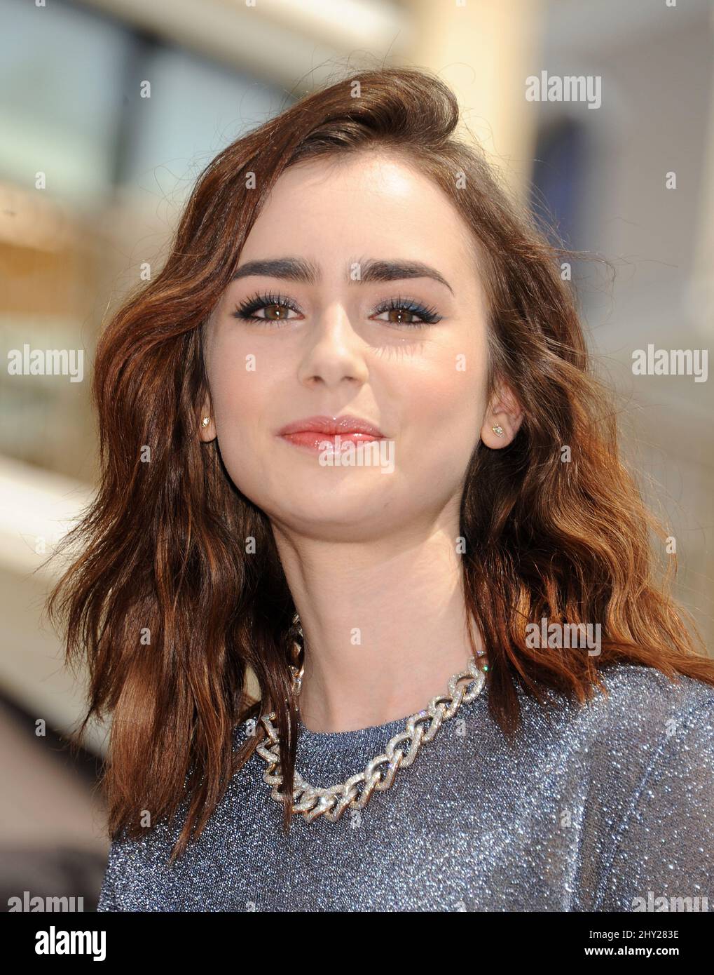 Lily Collins attending a "Mortal Instruments: City of Bones" Fan ...