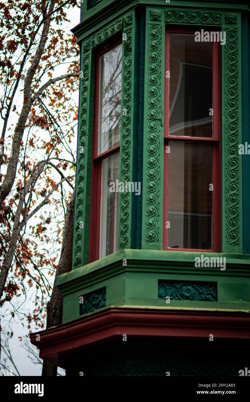 Exterior of a green building with windows Stock Photo - Alamy