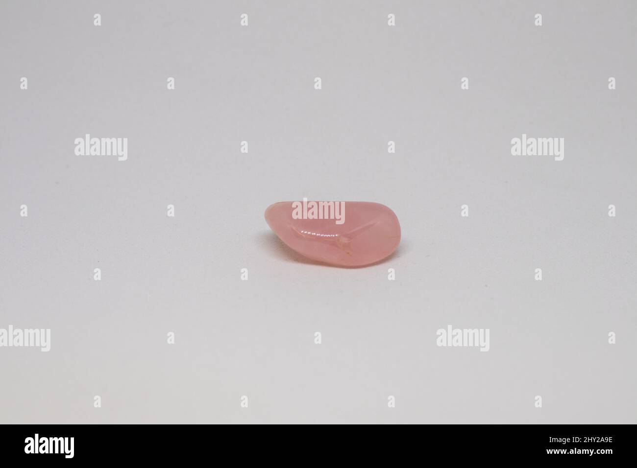 Closeup of a Rose Quartz mineral on a gray background Stock Photo - Alamy