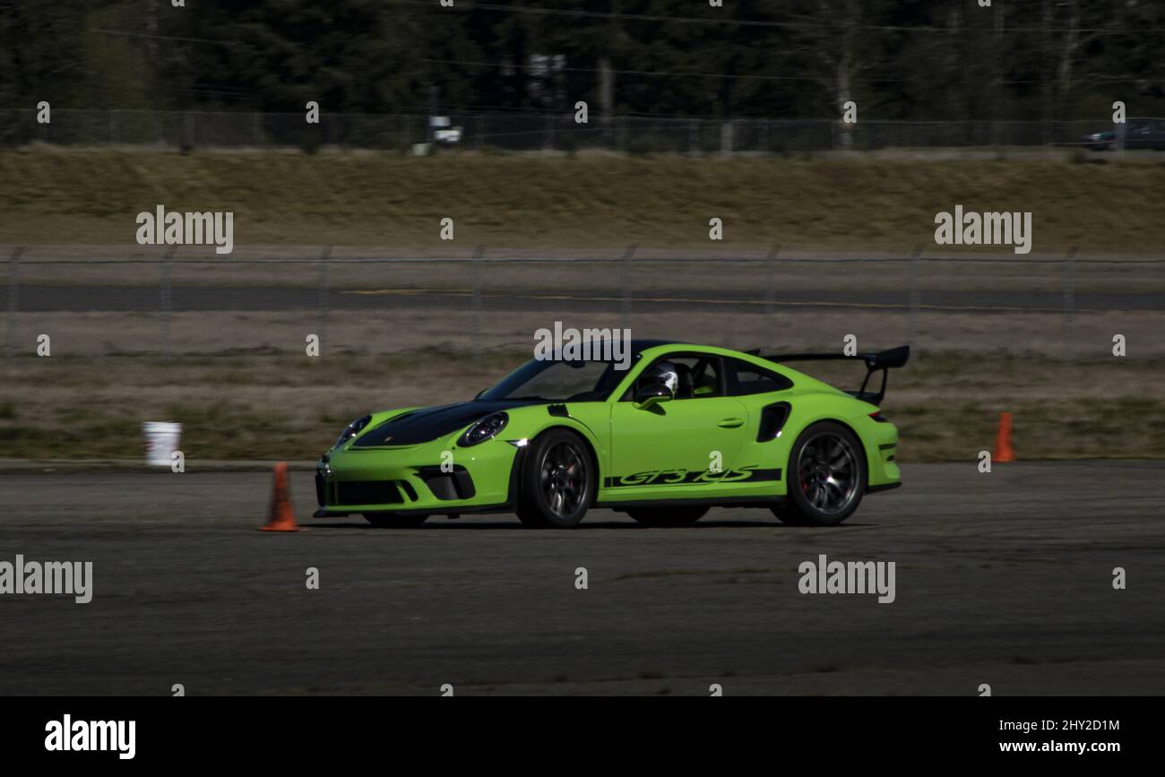 Green Porsche car racing on a runway in Washington Stock Photo - Alamy