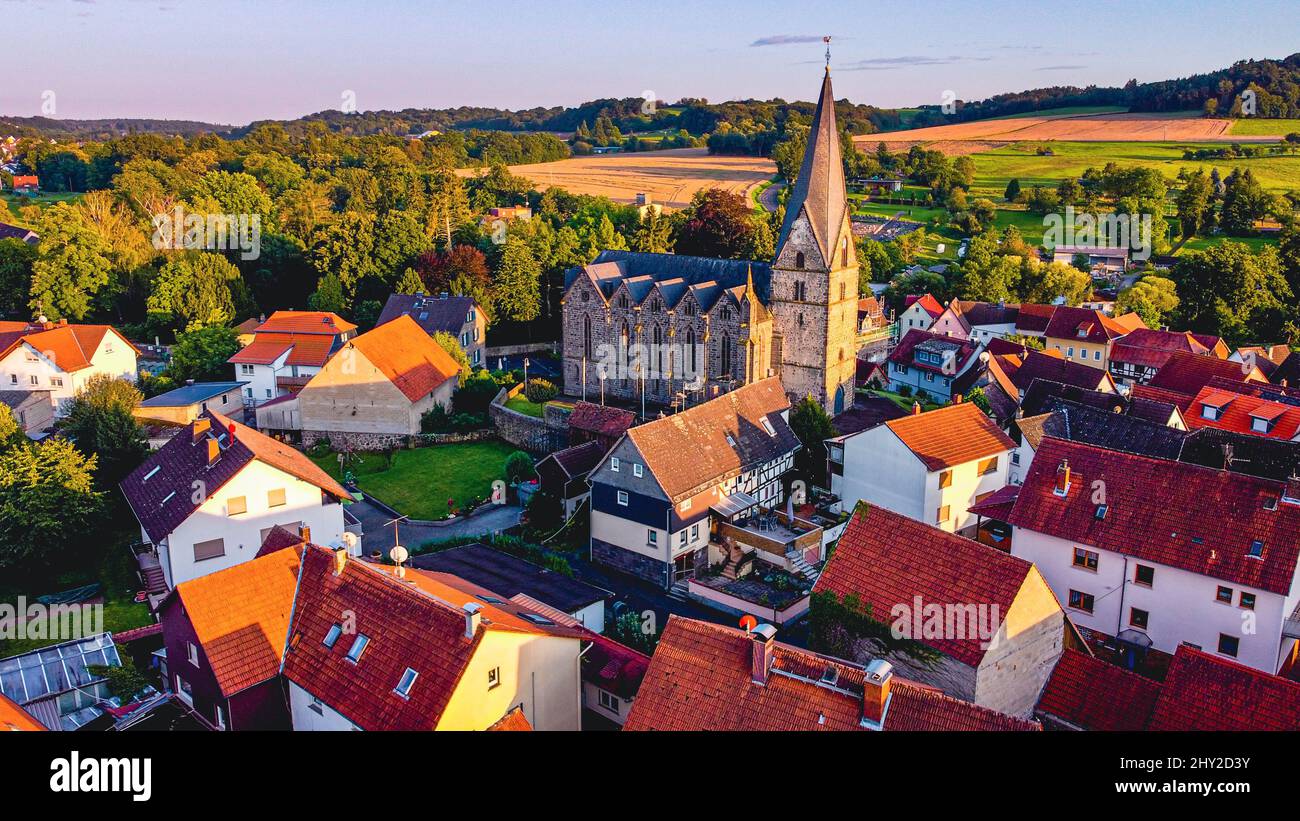 An Aerial view of the houses and green spaces of town Schotten, Hesse ...