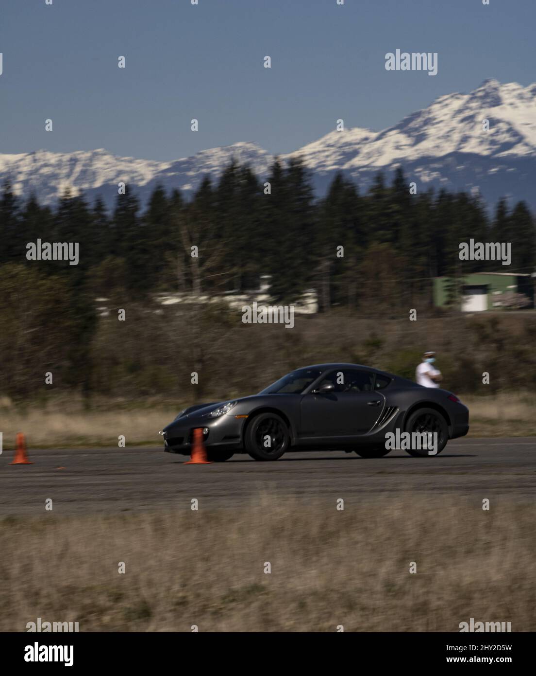 Black Porsche car racing on a runway in Washington Stock Photo - Alamy