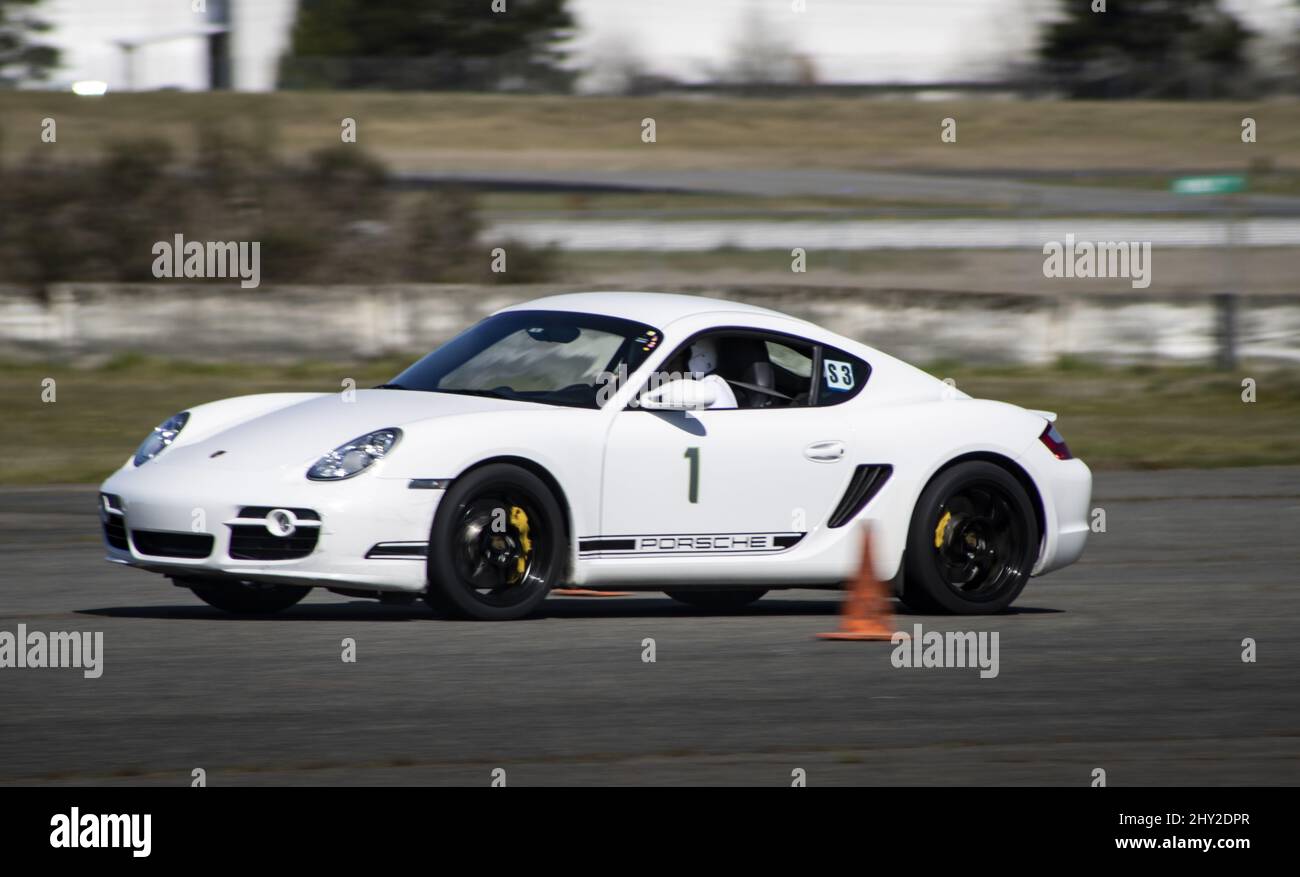 White Porsche carsracing on a runway in Washington Stock Photo - Alamy