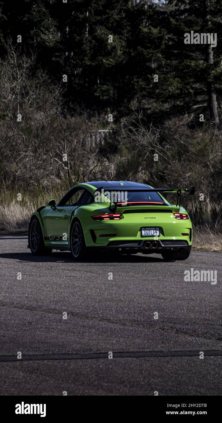 Green Porsche car racing on a runway in Washington Stock Photo - Alamy