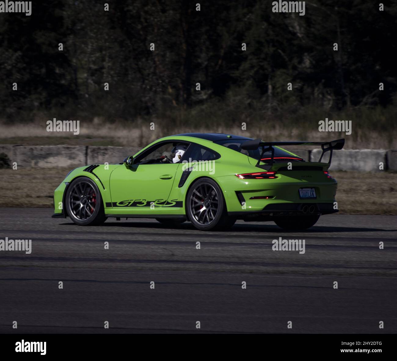 Green Porsche car racing on a runway in Washington Stock Photo - Alamy