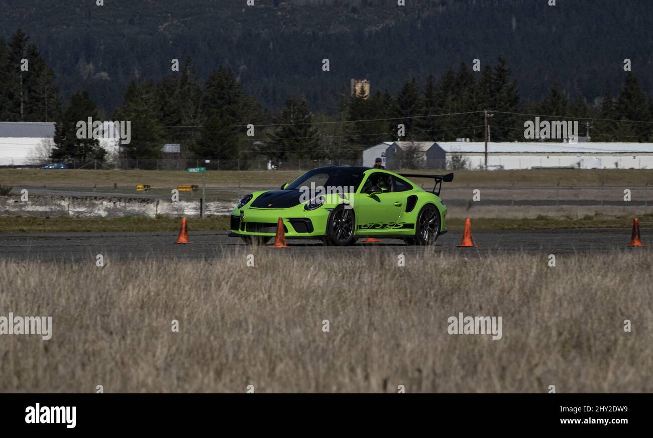 Green Porsche car racing on a runway in Washington Stock Photo - Alamy