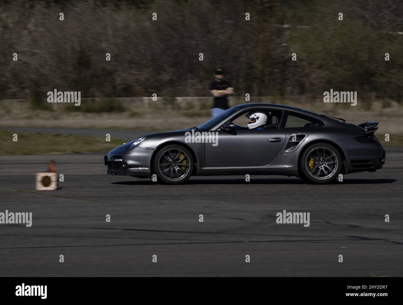 Dark gray Porsche car racing on a runway in Washington Stock Photo - Alamy
