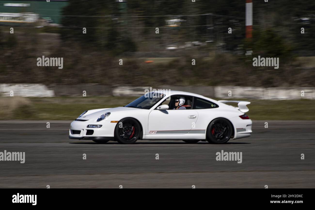 White Porsche car racing on a runway in Washington Stock Photo - Alamy