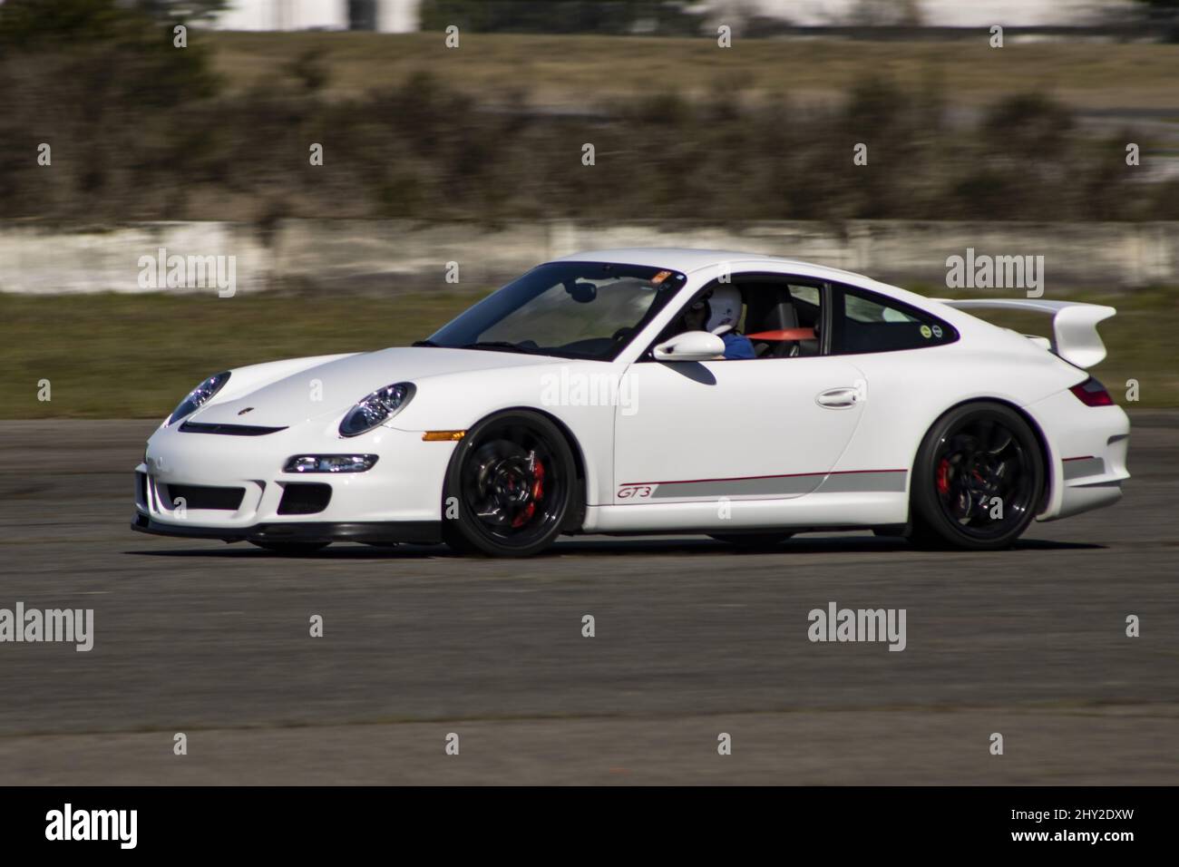 White Porsche car racing on a runway in Washington Stock Photo - Alamy