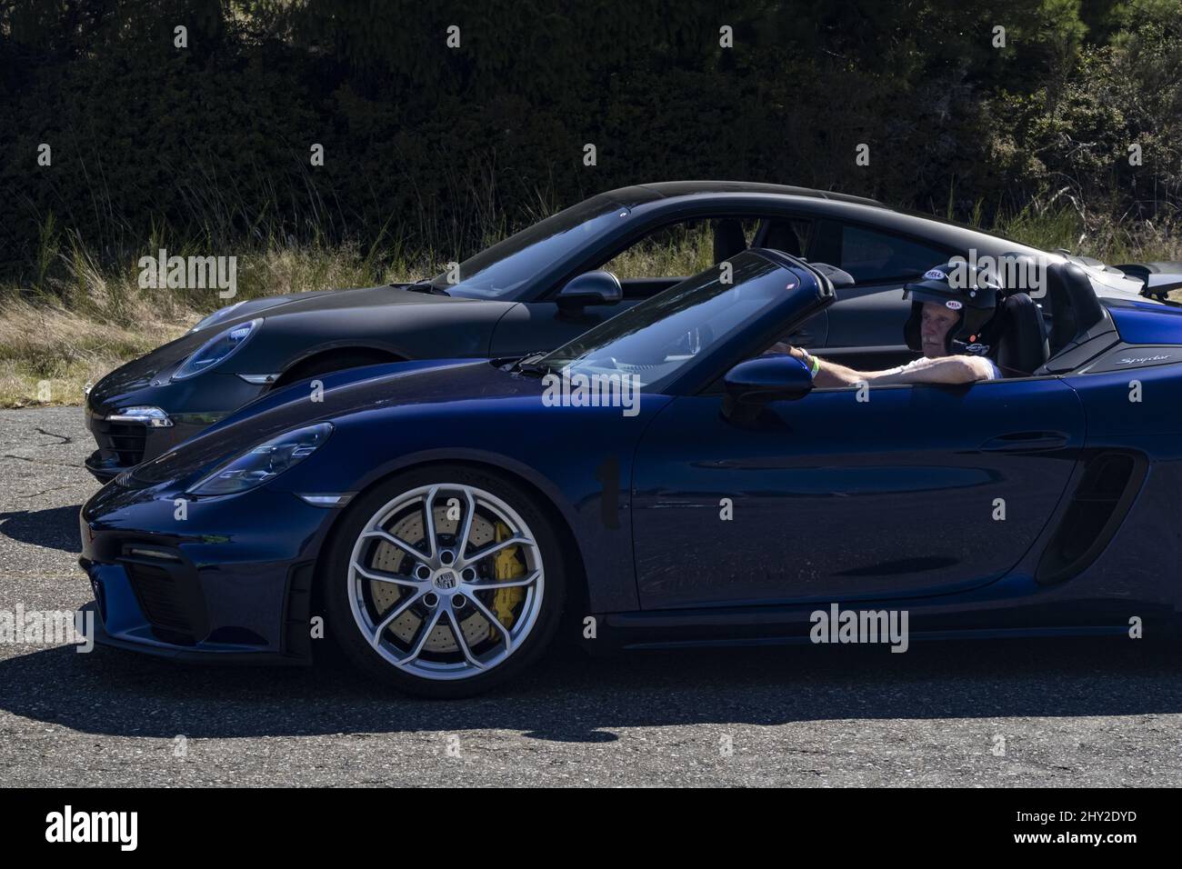 Blue Porsche car racing on a runway in Washington Stock Photo - Alamy