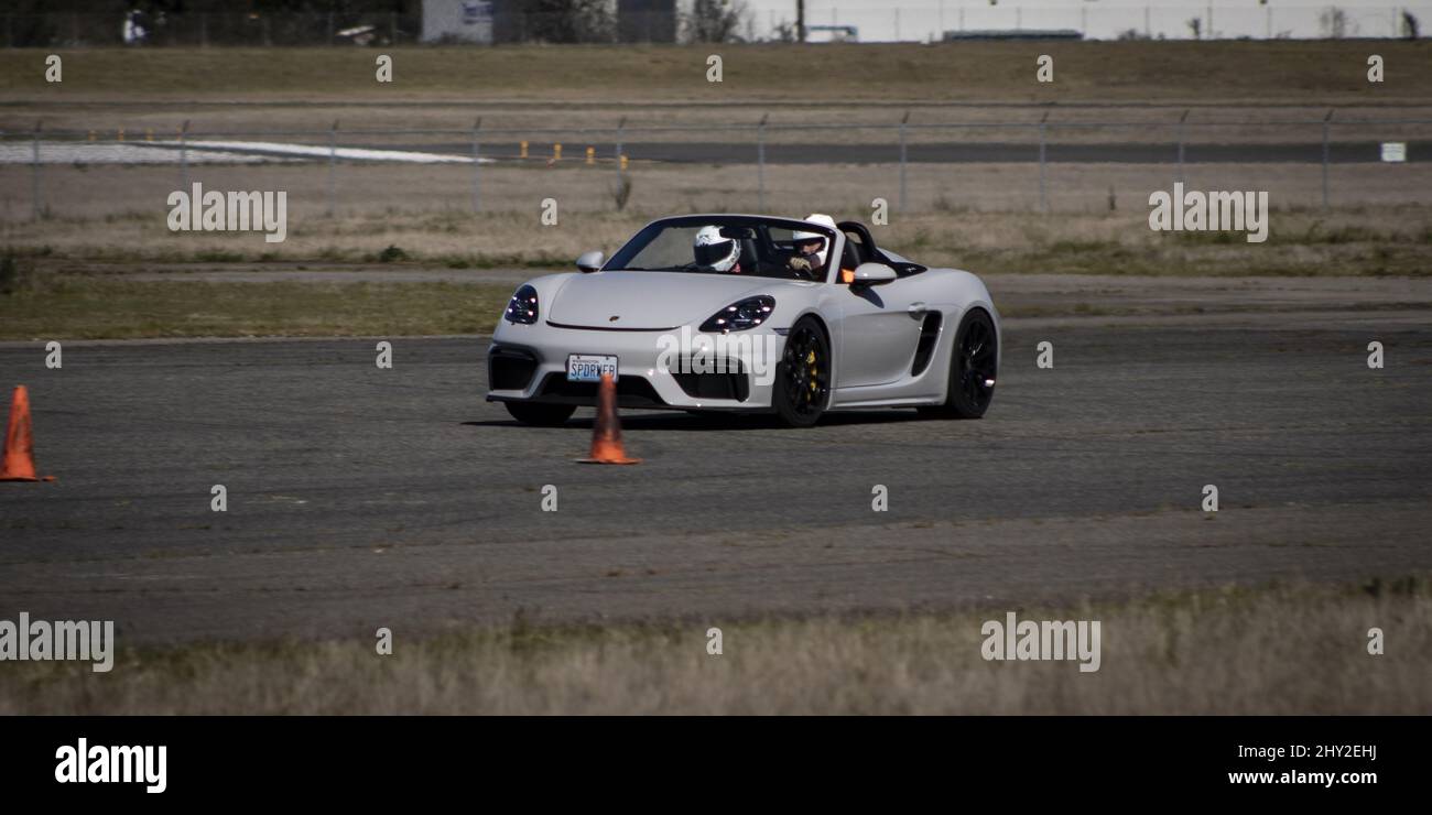 White Porsche car racing on a runway in Washington Stock Photo - Alamy