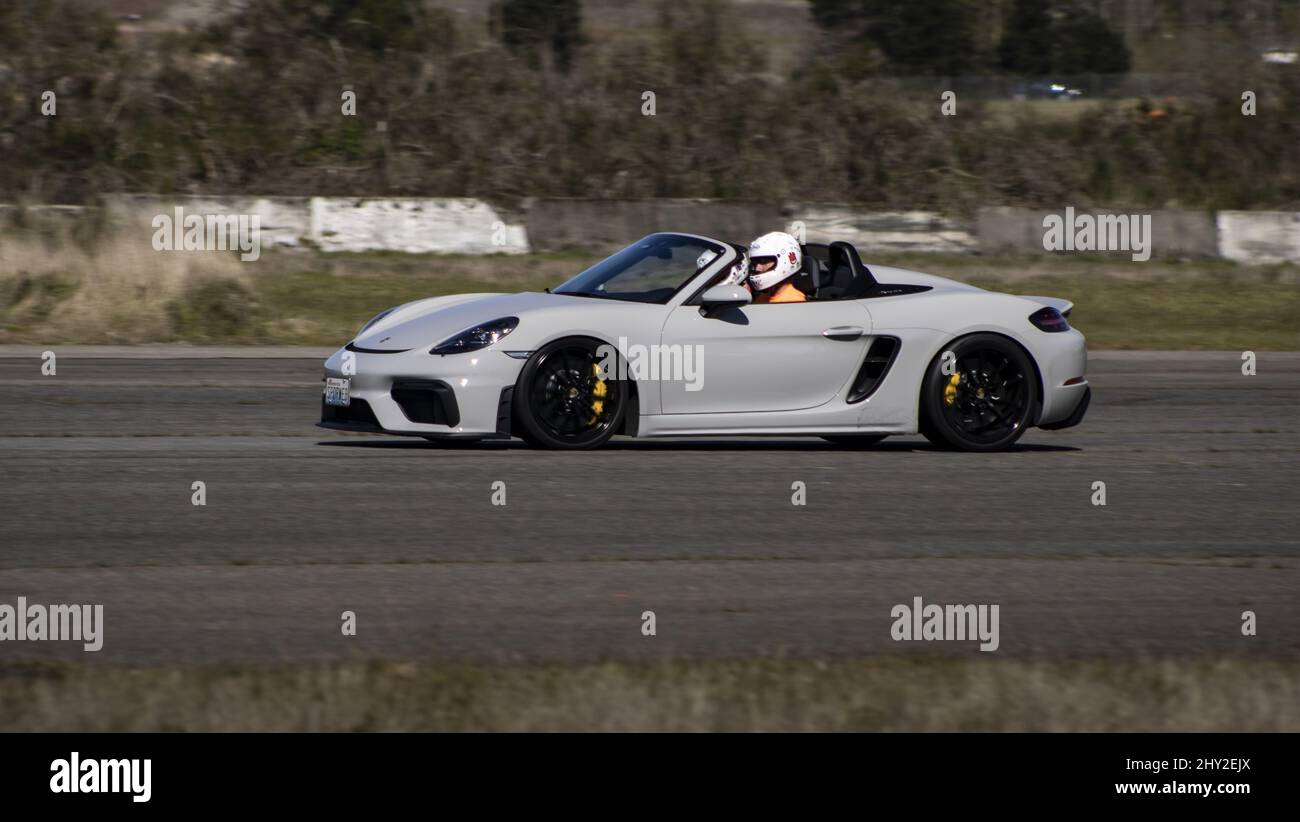 White Porsche car racing on a runway in Washington Stock Photo - Alamy