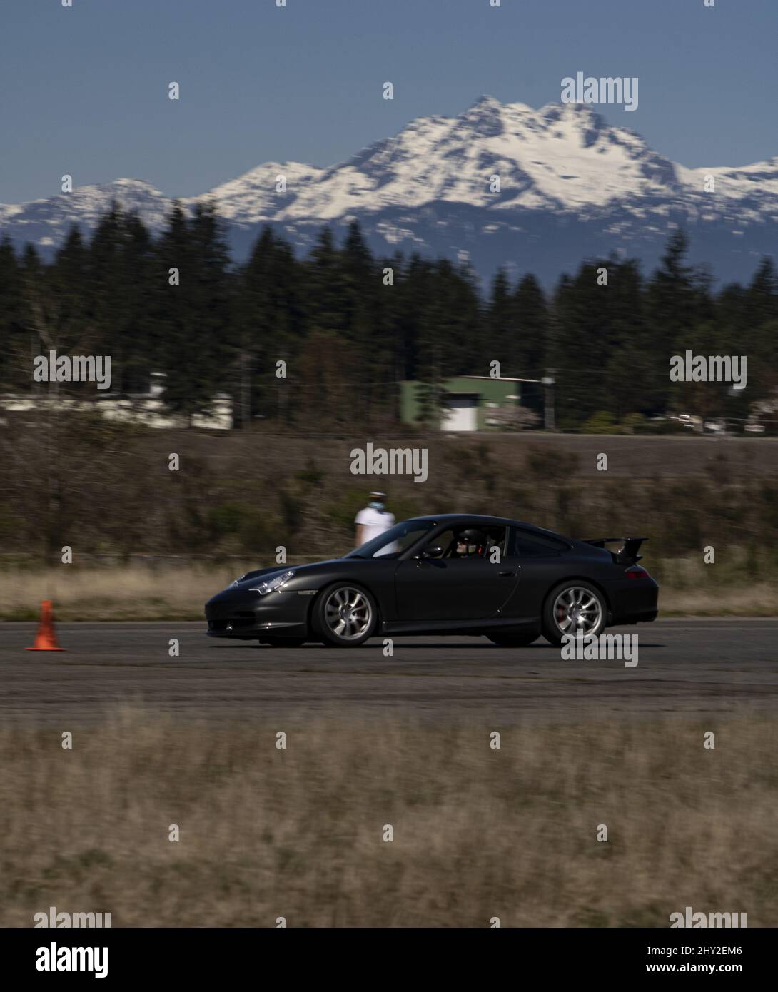 Black Porsche car racing on a runway in Washington Stock Photo - Alamy