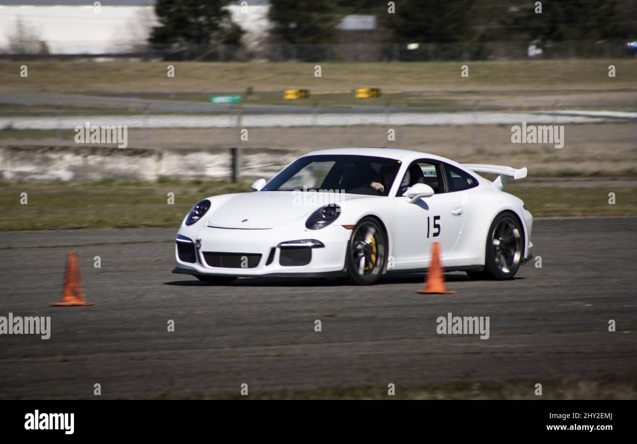 White Porsche car racing on a runway in Washington Stock Photo - Alamy