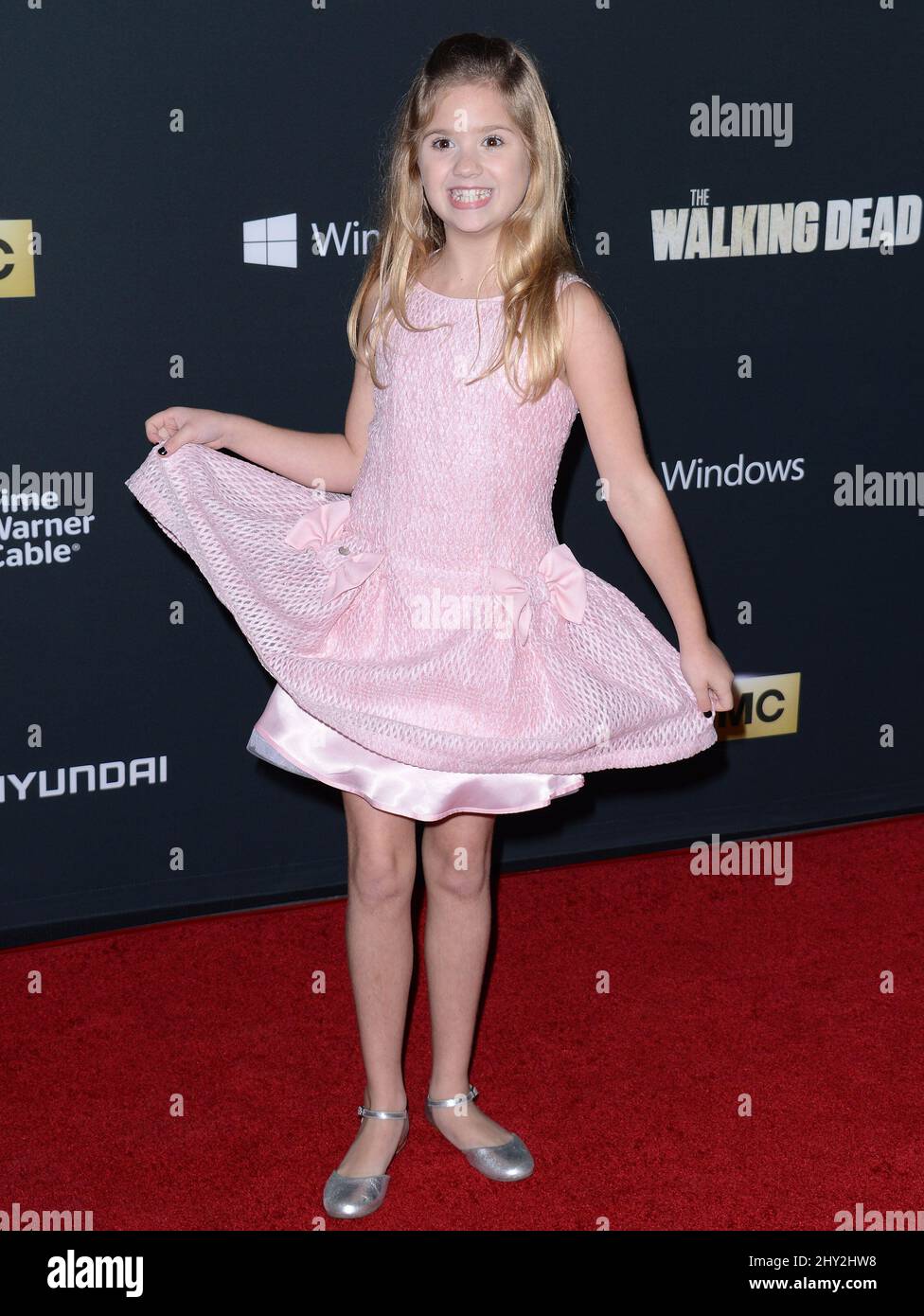 Kyla Kenedy attending the premiere of season four of The Walking Dead ...