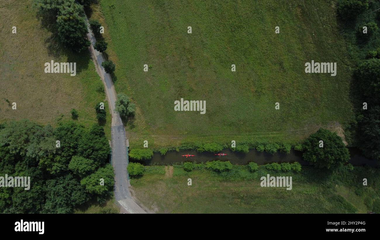 Aerial view of the kayakers kayaking in the flowing river in the ...