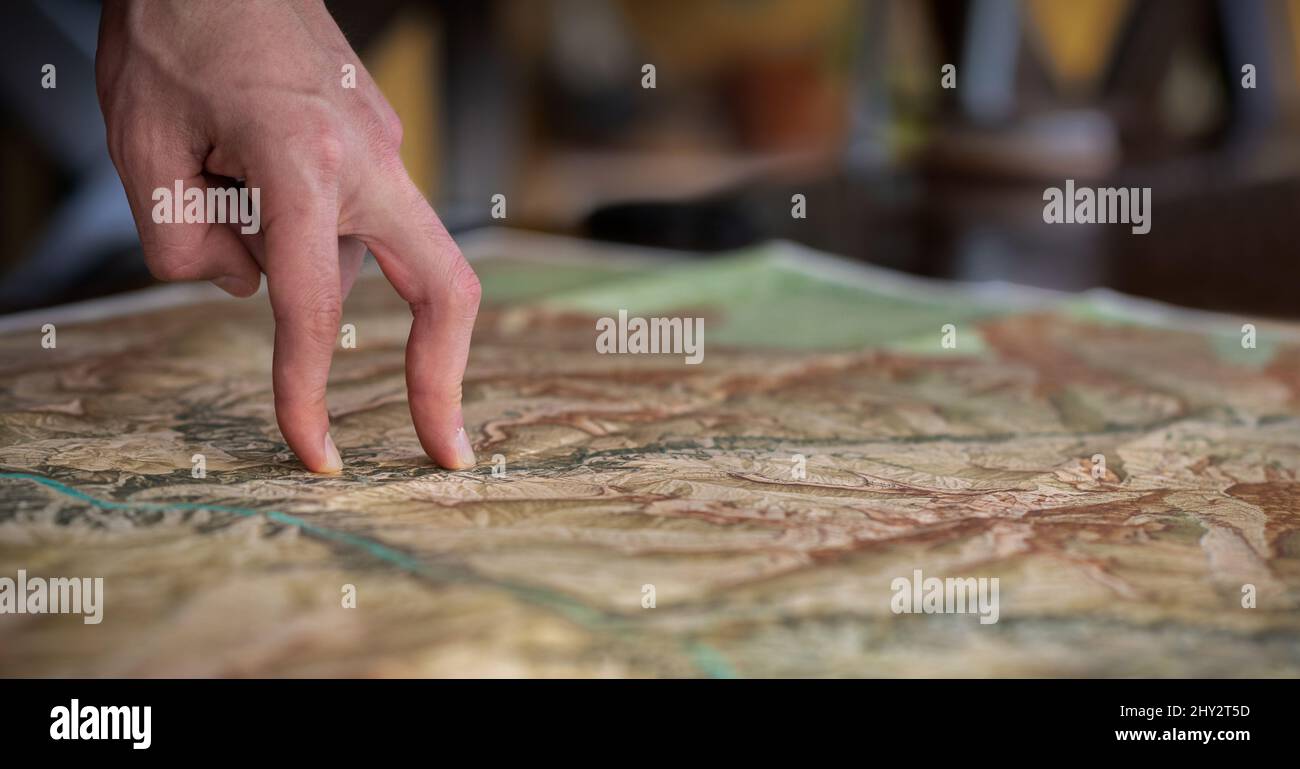 Hand of a male showing places on the map with two fingers Stock Photo ...