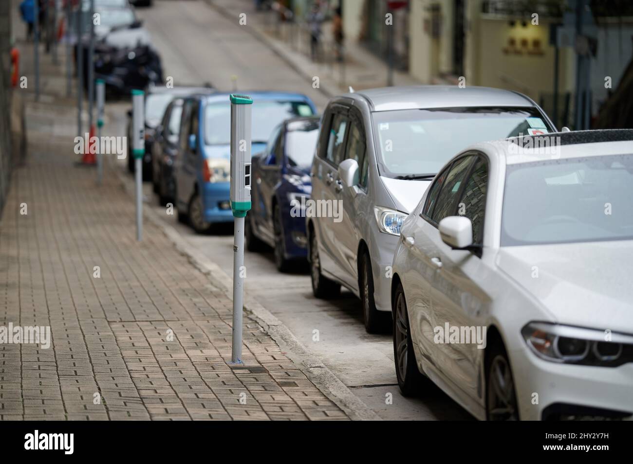 Street view with cars in Hong Kong Stock Photo - Alamy