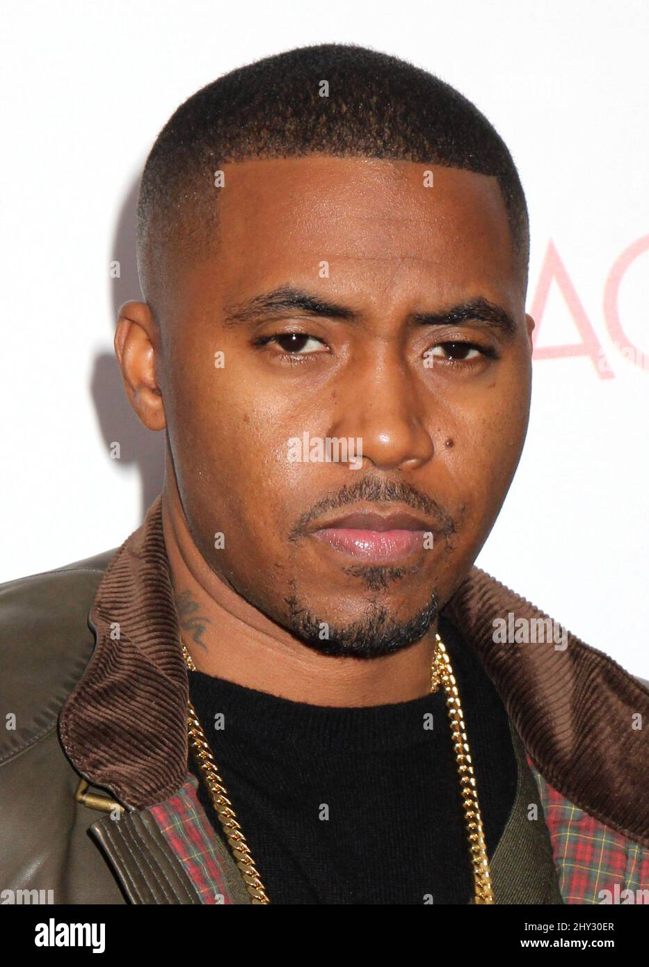 Nas Fade Haircut With Part