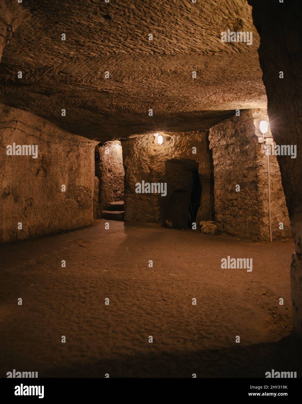 Vertical shot of an underground city or catacomb corridor wirth stone ...