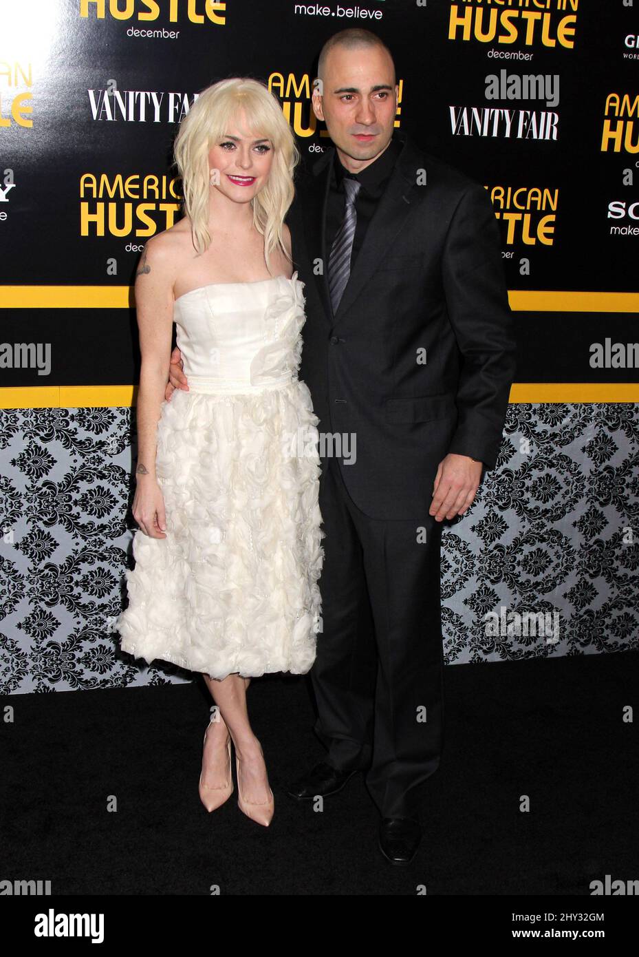 Taryn Manning and Jay Giannone attending the "American Hustle" premiere ...