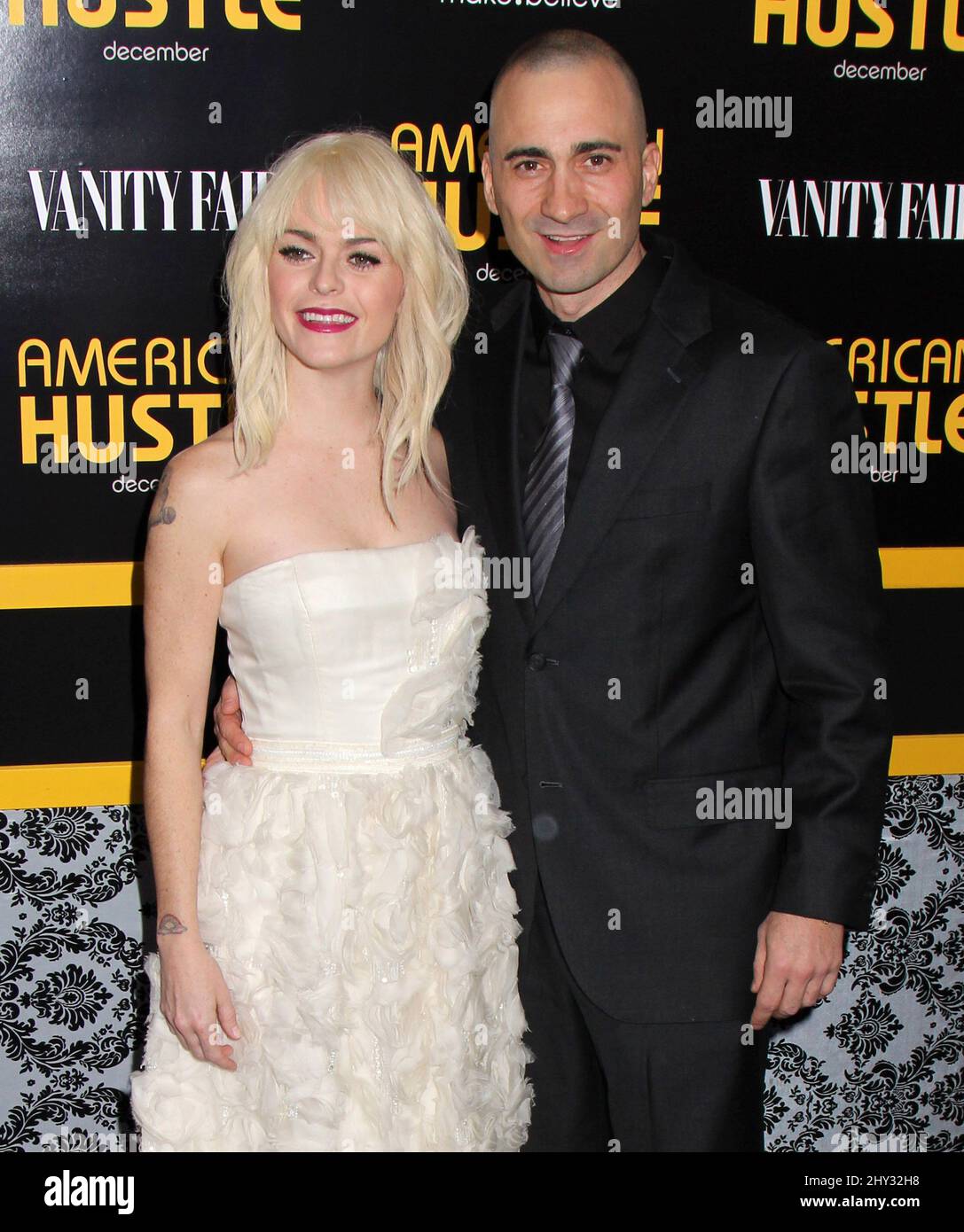 Taryn Manning and Jay Giannone attending the "American Hustle" premiere ...