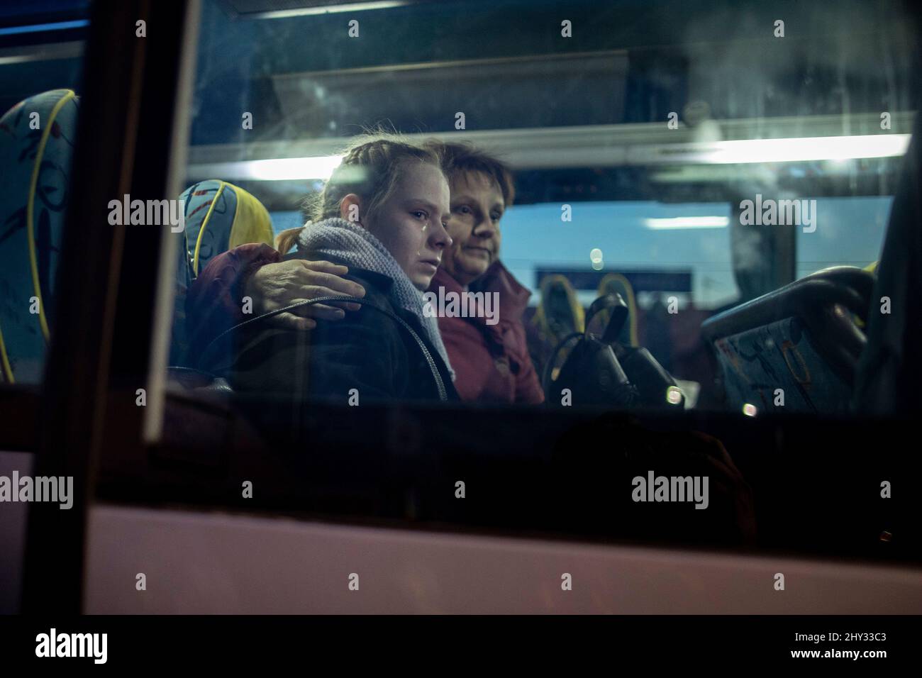 Przemysl, Poland. 14th Mar, 2022. Women from Ukraine sit on a bus ...