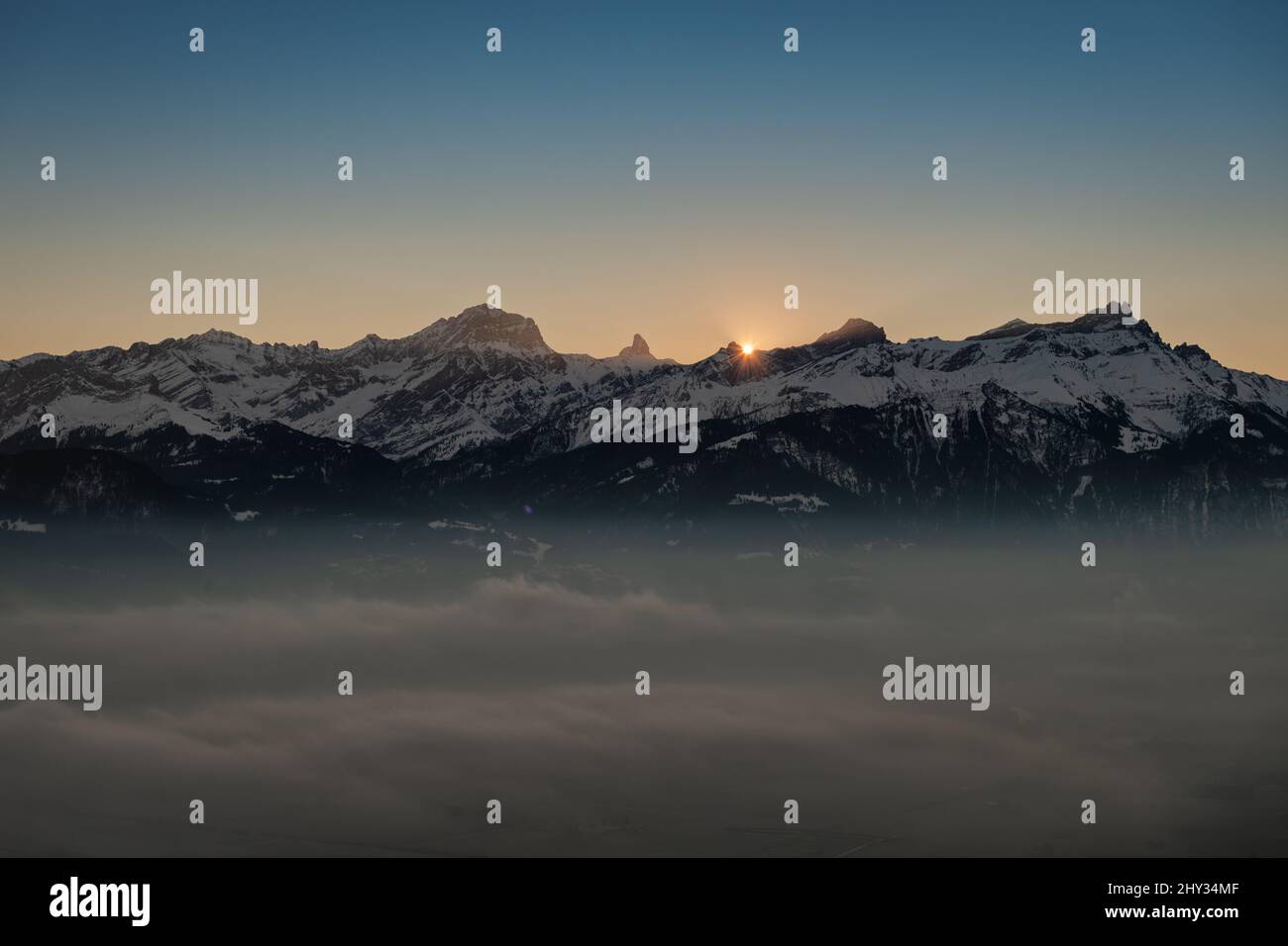 Beautiful sunrise over an alpine mountain in Switzerland Stock Photo ...