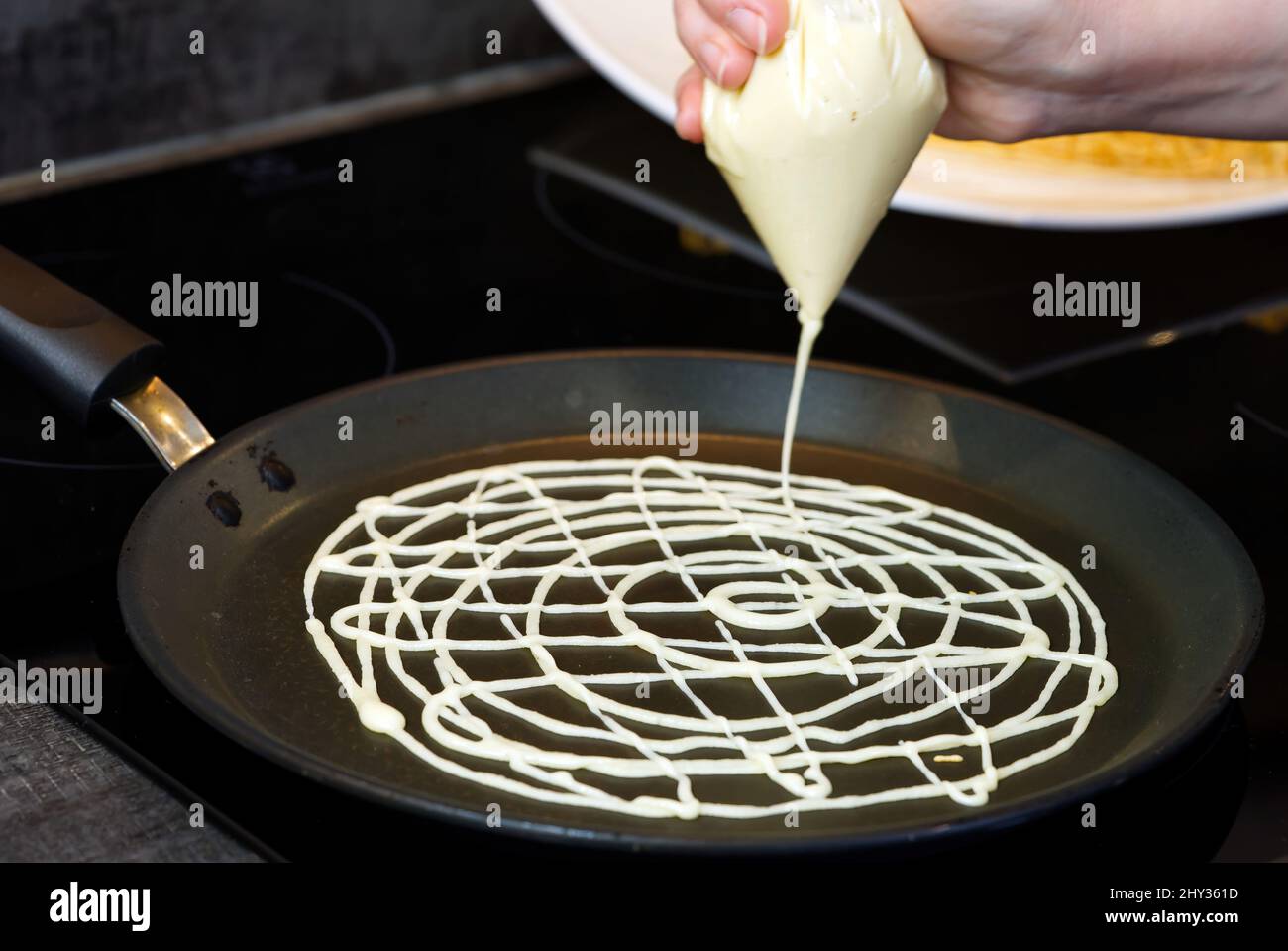 Cooking net pancakes at home. unusual street food. Roti Jala malaysian ...