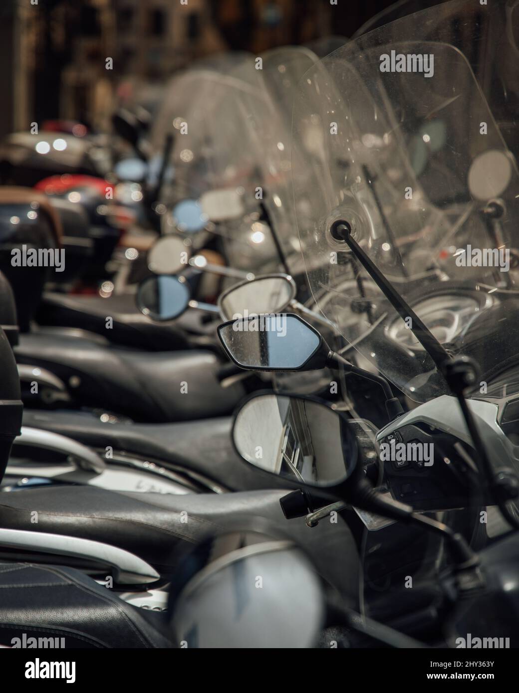 A vertical shot of motorcycles parked in a row Stock Photo - Alamy