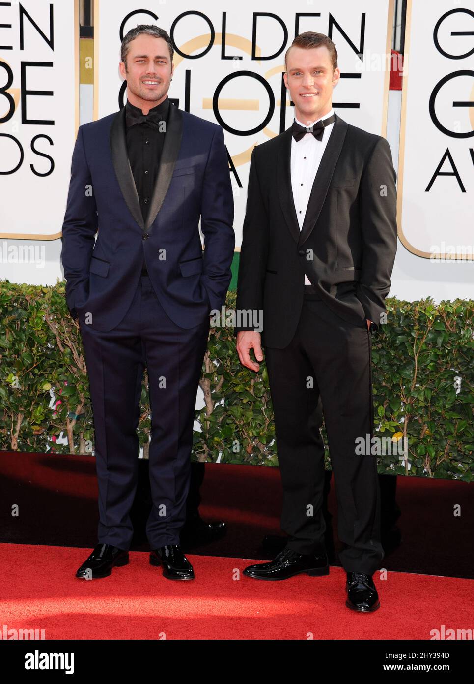Taylor Kinney & Jesse Spencer arriving at the 71st annual Golden Globe ...