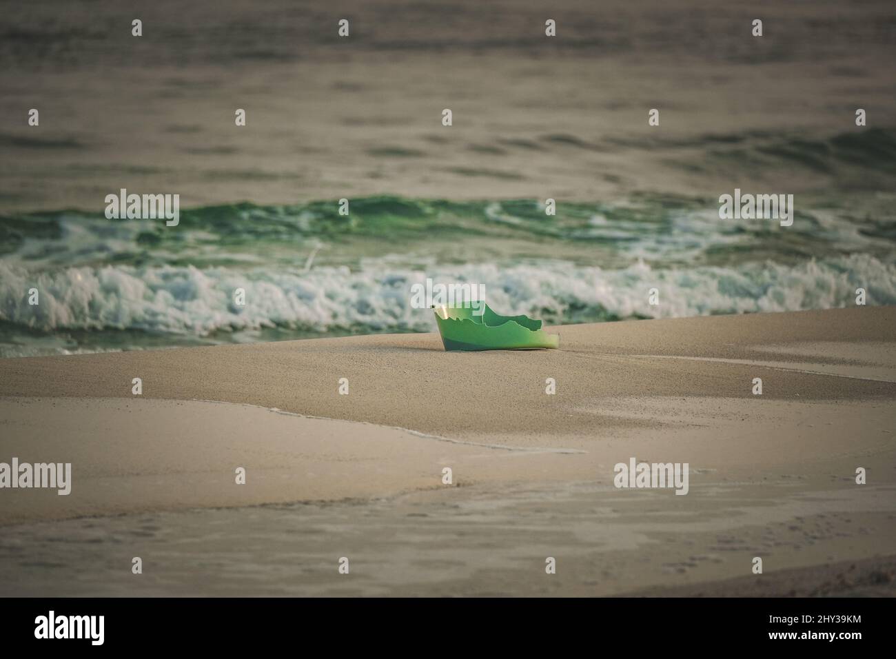Broken plastic container on the beach Stock Photo - Alamy