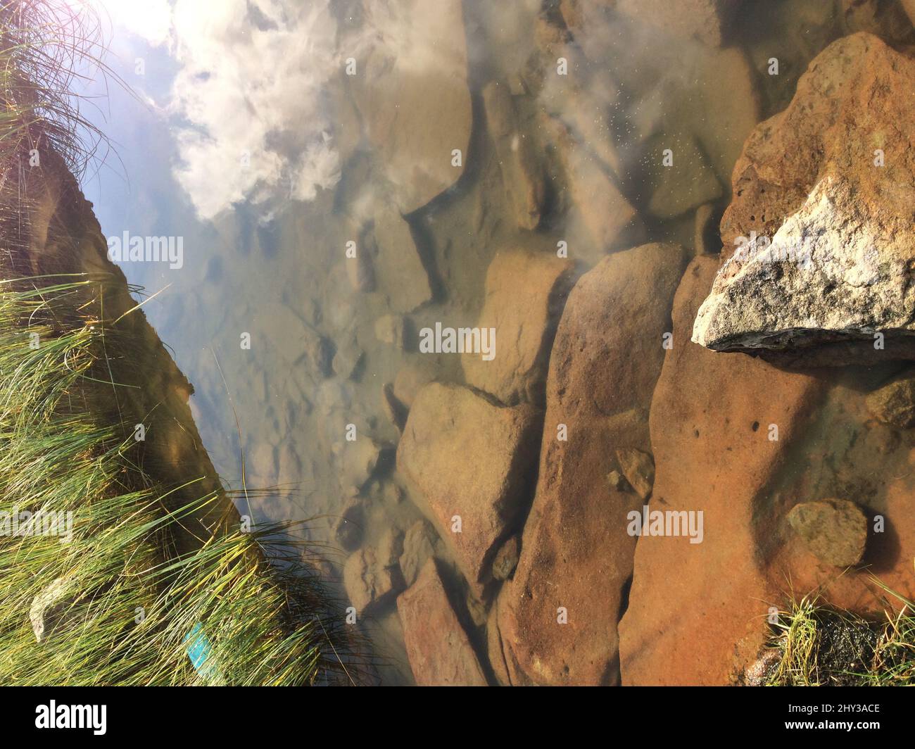 Vertical top view of stone pieces in a lake Stock Photo - Alamy