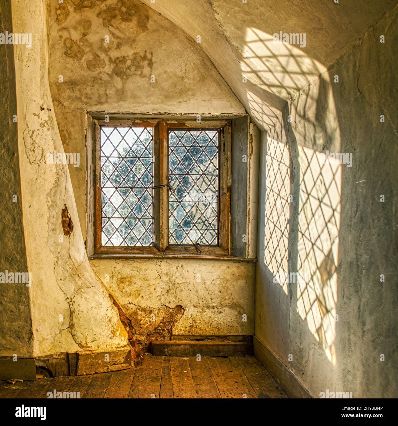 Wooden window with the sunlight shadow on wall in old building Stock ...
