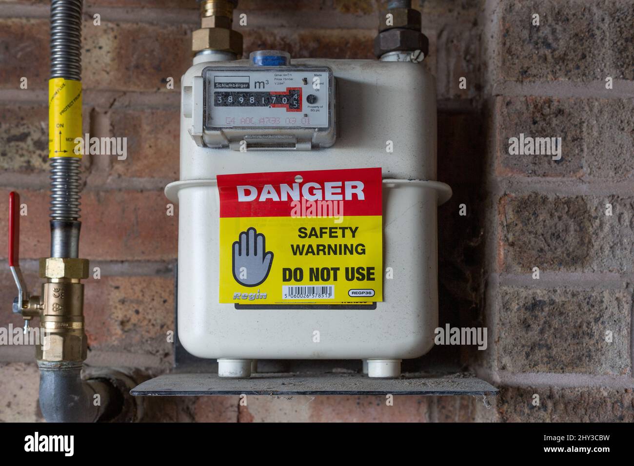 A gas meter with a danger safety warning sticker Stock Photo - Alamy