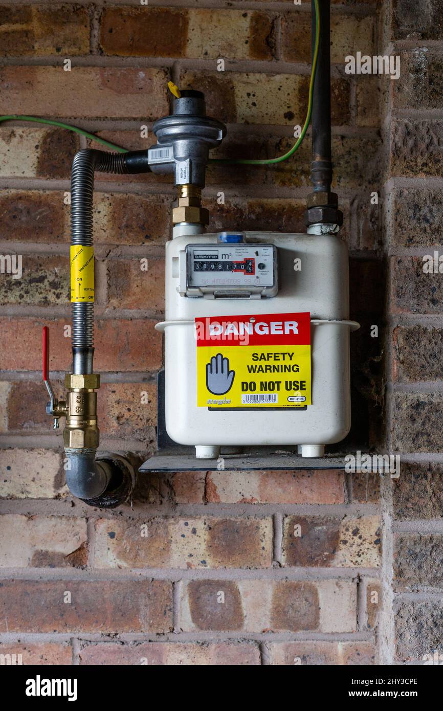 A gas meter with a danger safety warning sticker Stock Photo - Alamy