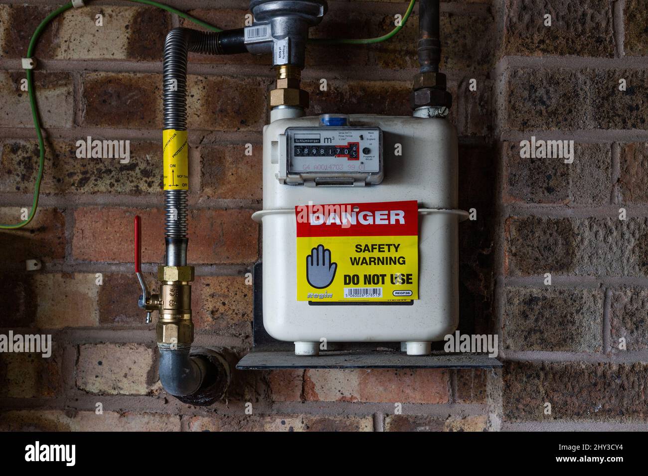 A gas meter with a danger safety warning sticker Stock Photo - Alamy