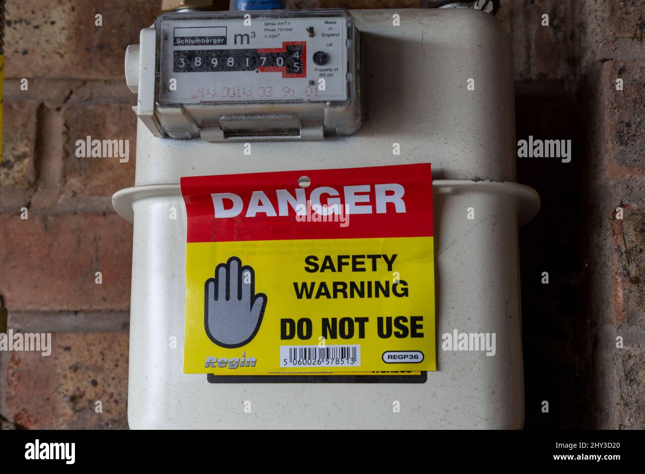A gas meter with a danger safety warning sticker Stock Photo - Alamy