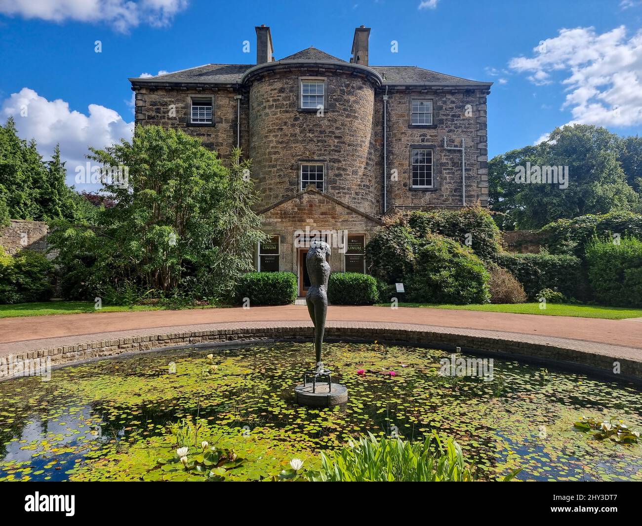 Garden with a pool and a statue in front of the historical Inverleith ...