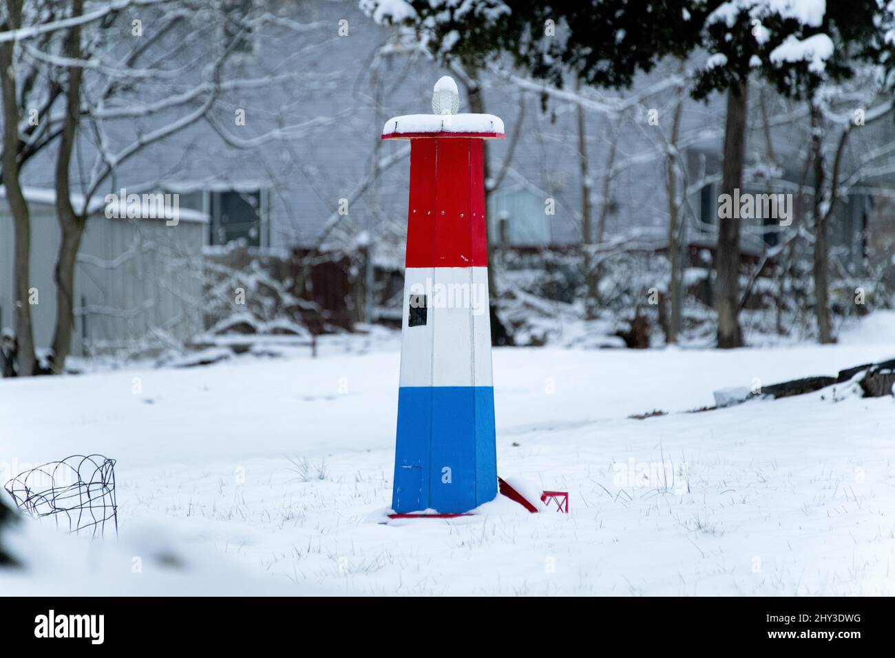 Closeup of a lighthouse covered in snow Stock Photo - Alamy