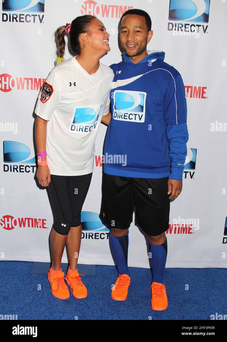 Chrissy Teigen and John Legend attending DIRECTV's 8th Annual Celebrity ...