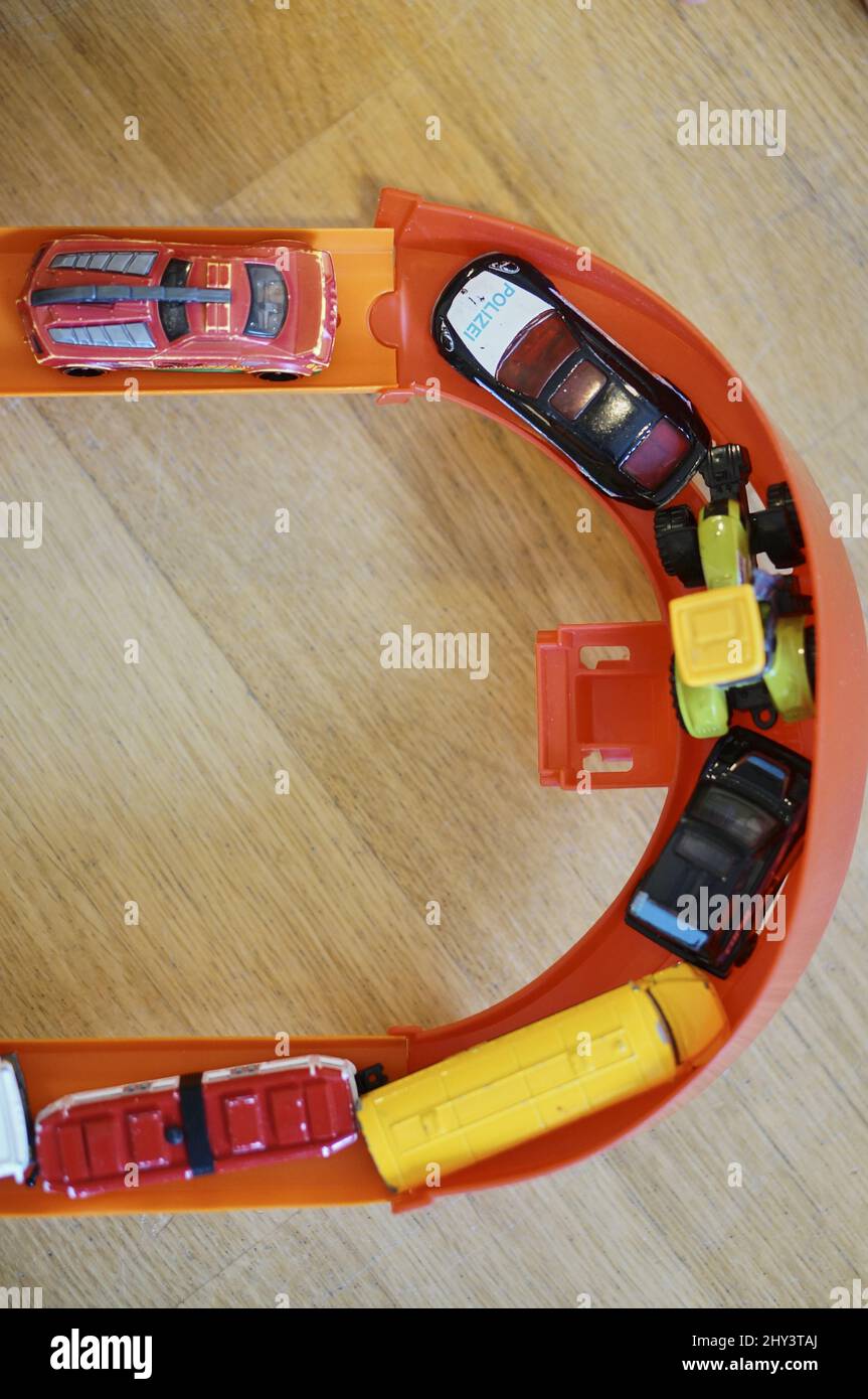 Top view of Mattel Hot Wheels cars on a racing track Stock Photo - Alamy