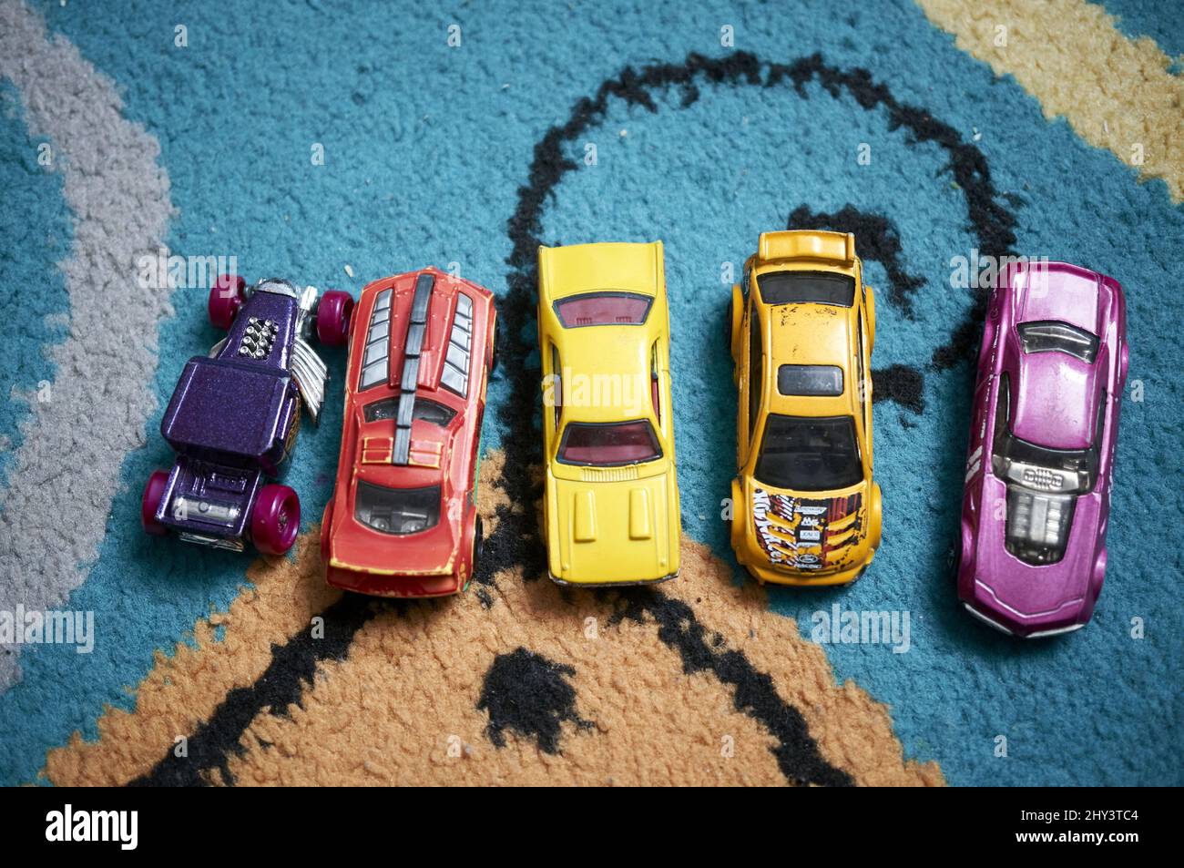 Top view of Mattel Hot Wheels toy model cars collection on a carpeted ...